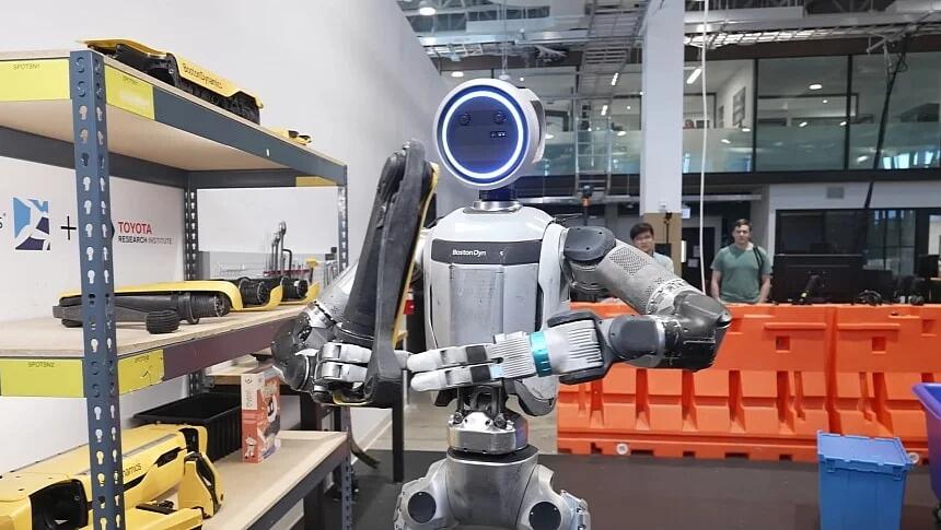 Atlas Robot Moves Spot Parts From One Place To Another As Humans Keep ...